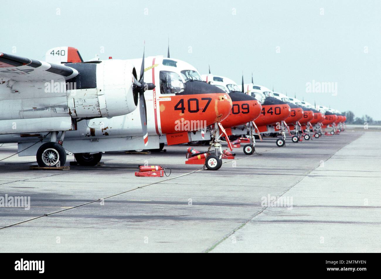 A right front view of several S-2 Tracker aircraft parked on the flight ...