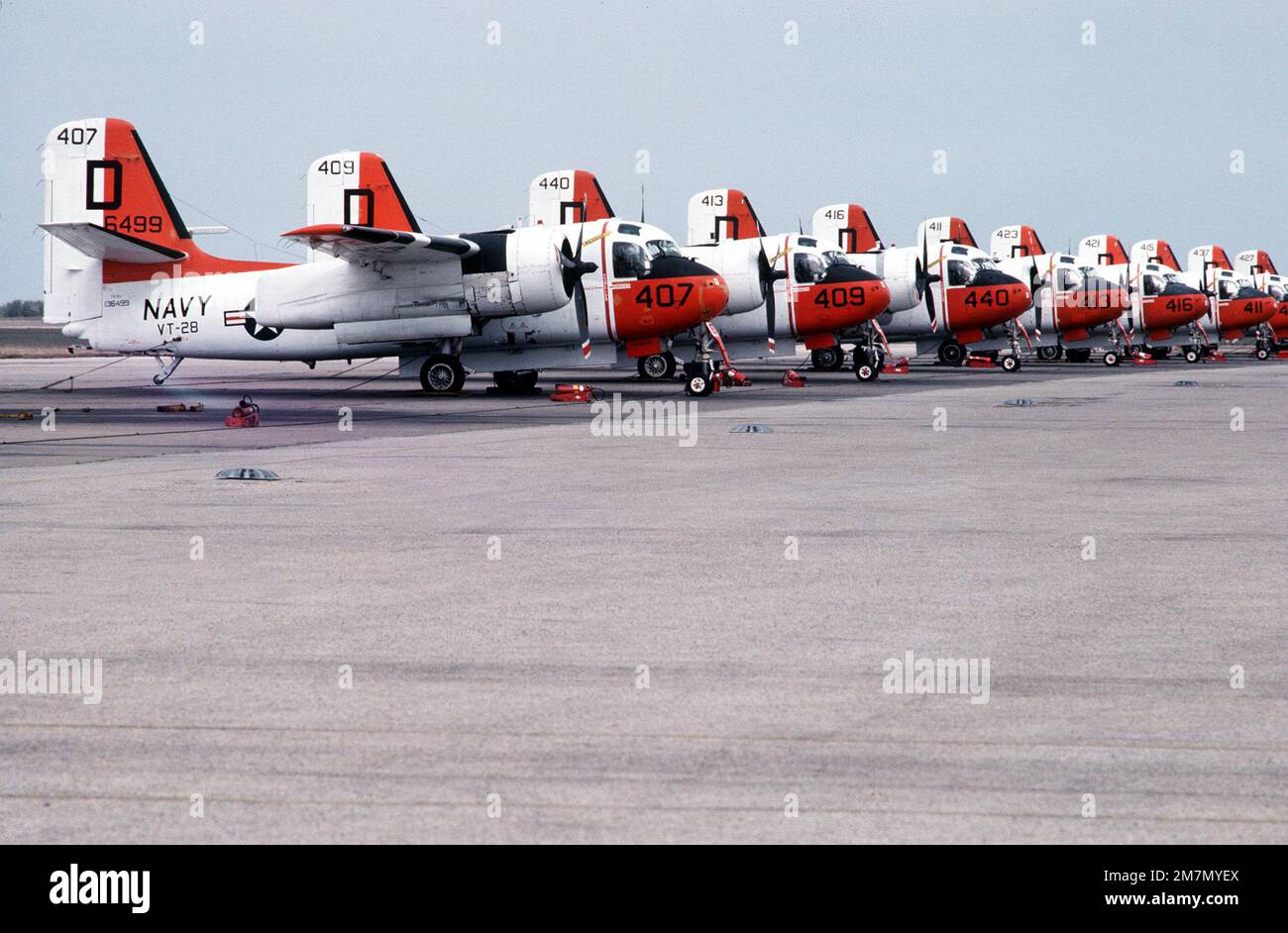 A right front view of several S-2 Tracker aircraft parked on the flight ...