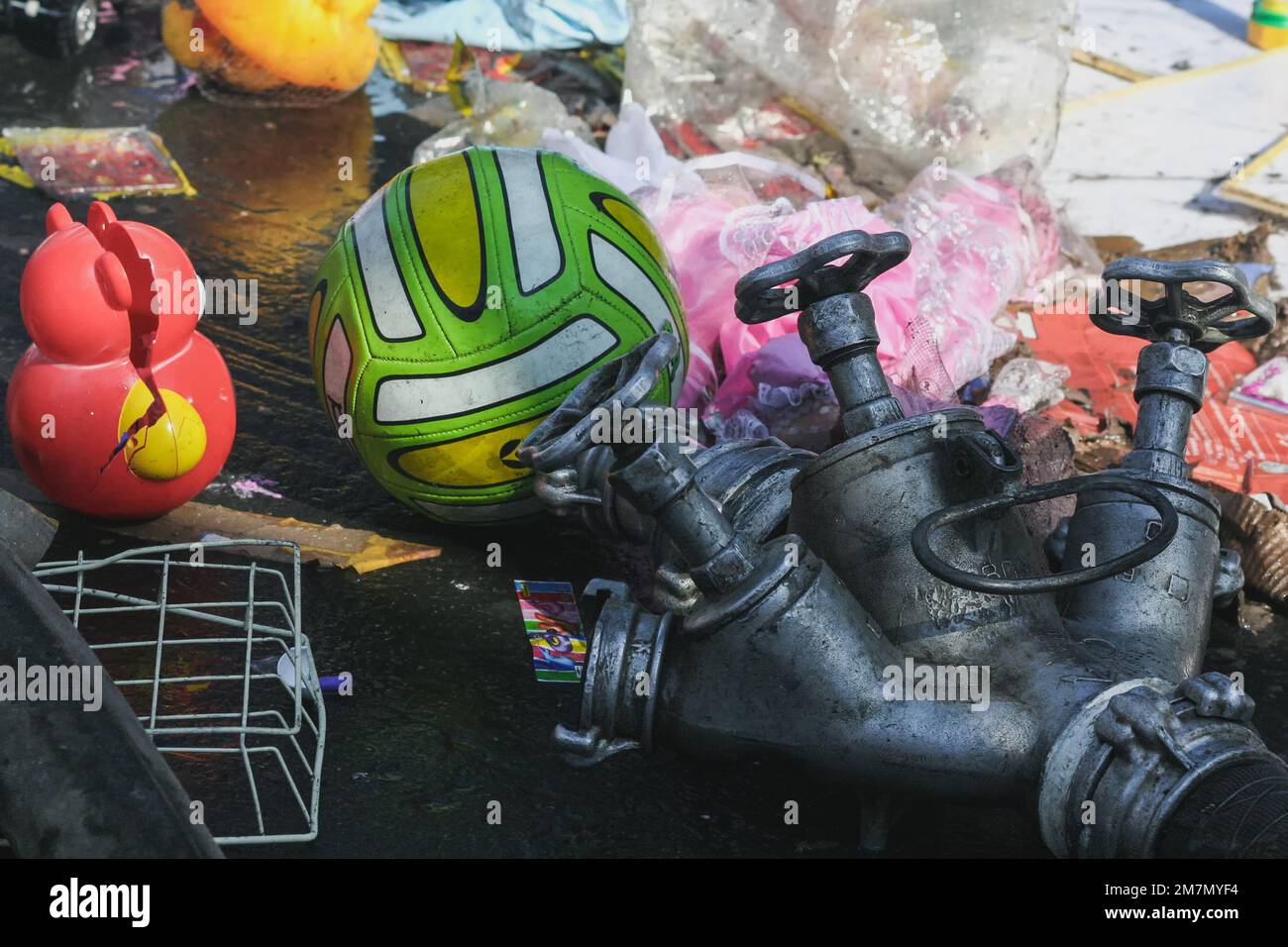 Fire hoses with faucets after a fire among toys, hydrant Stock Photo ...