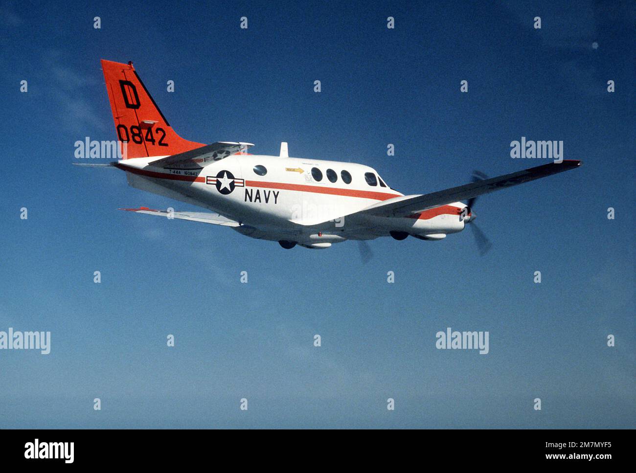 An air-to-air right side view of a T-44A aircraft. Country: Unknown ...