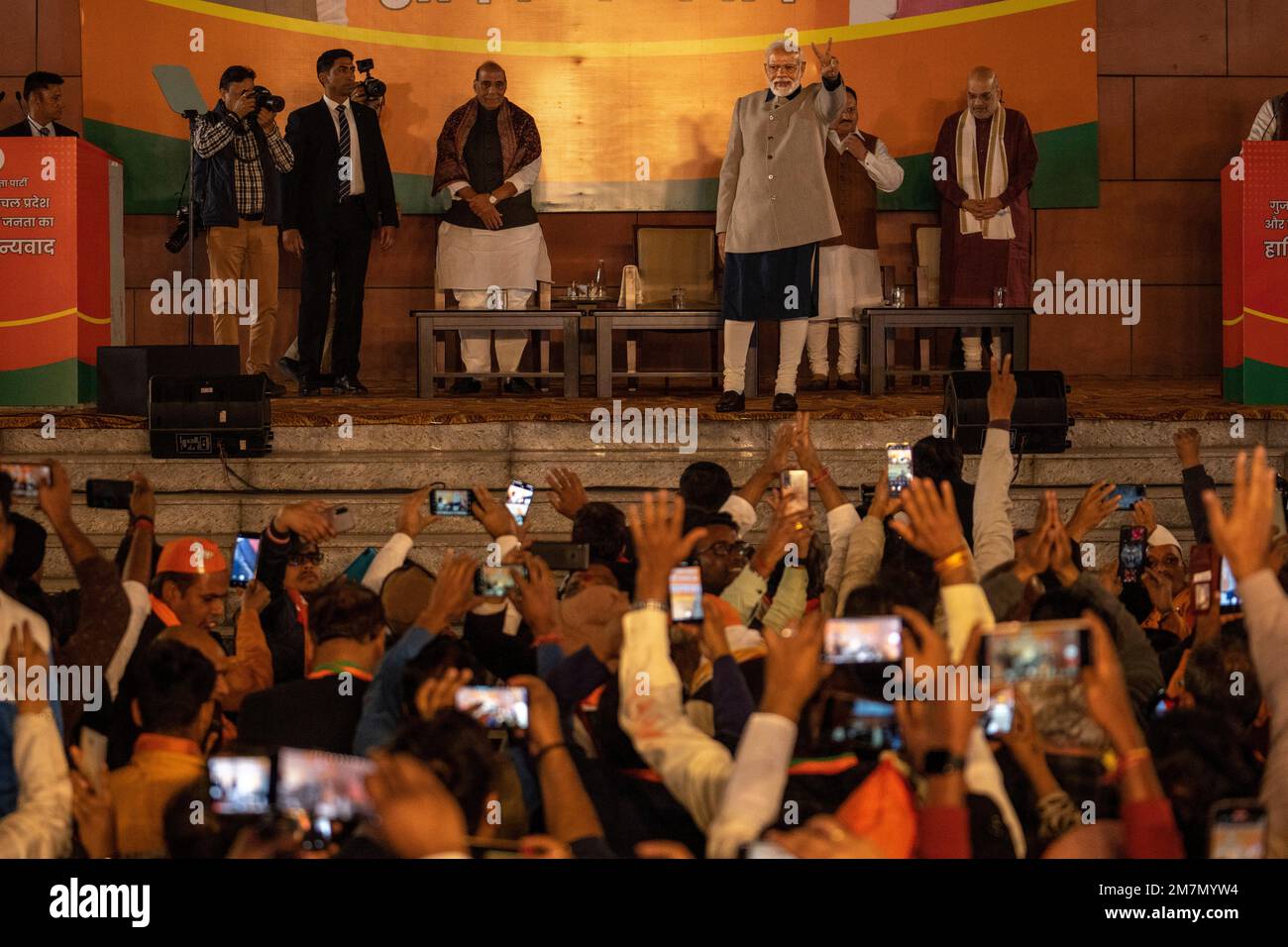 Indian Prime Minister Narendra Modi flashes a victory sign at the ...