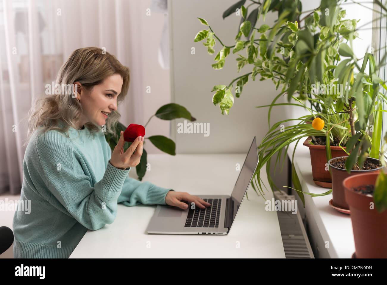 Box with rings and laptop on table of wedding planner Stock Photo - Alamy