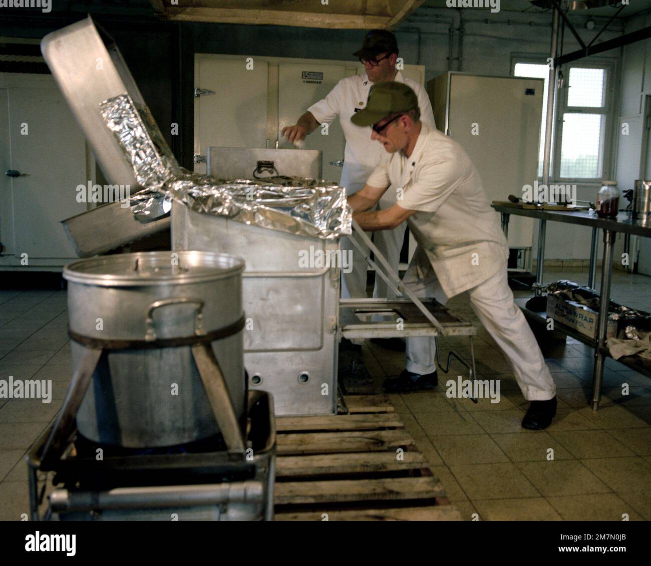Cooks prepare meals for Co. A, 168th Armor, 157th Infantry Bde., during ...