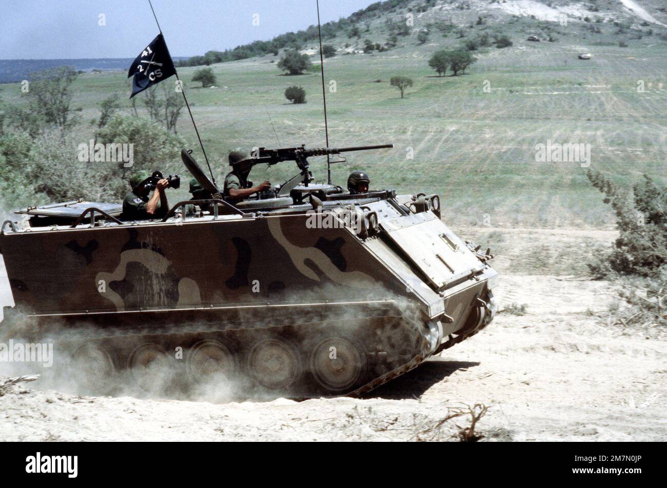 An Air Force cameraman films the action as an M-113 armored personnel ...