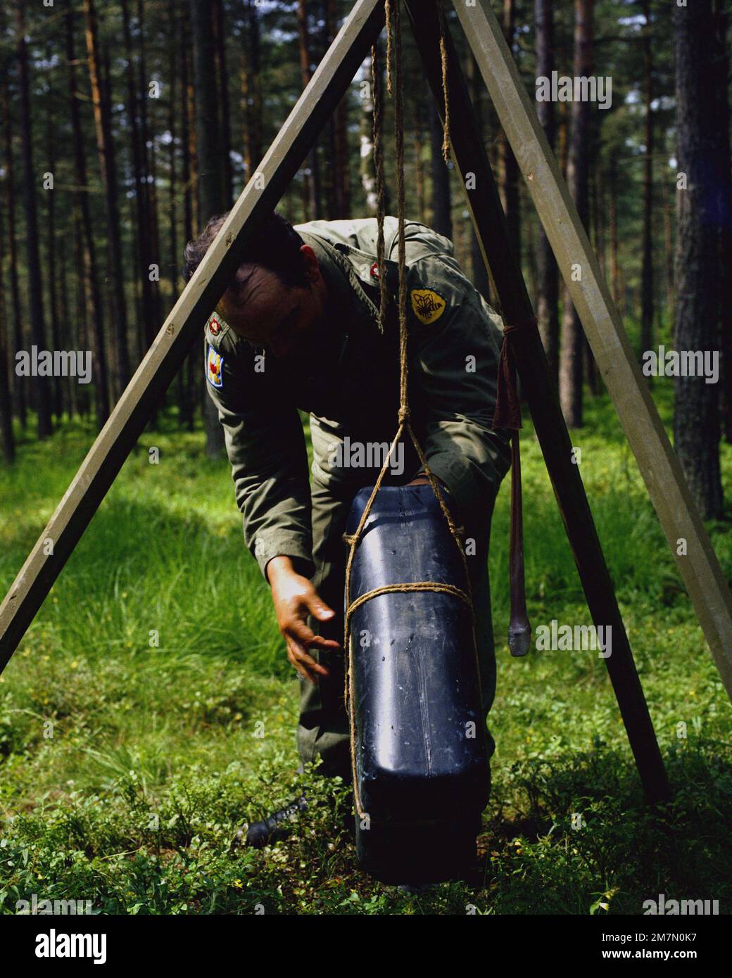 SGT Jay Carter, 1457th Engineer Battalion, refreshes himself by washing ...