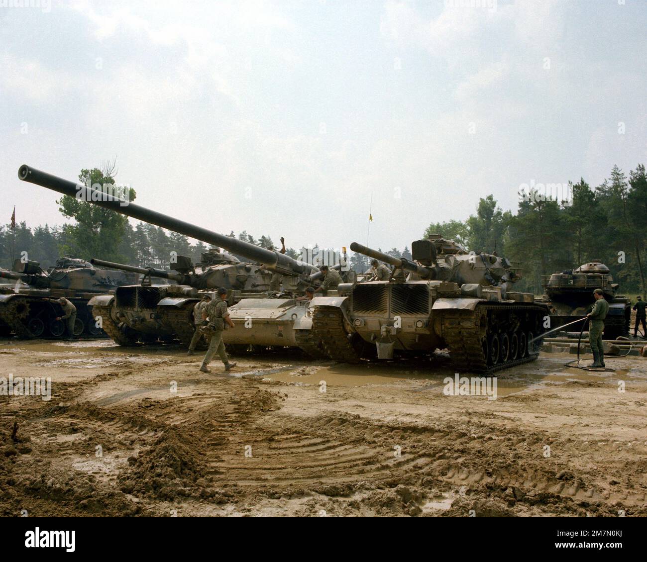 Members of Co. A, 4th Bn., 73rd Armor, wash M-60 tanks and a British ...