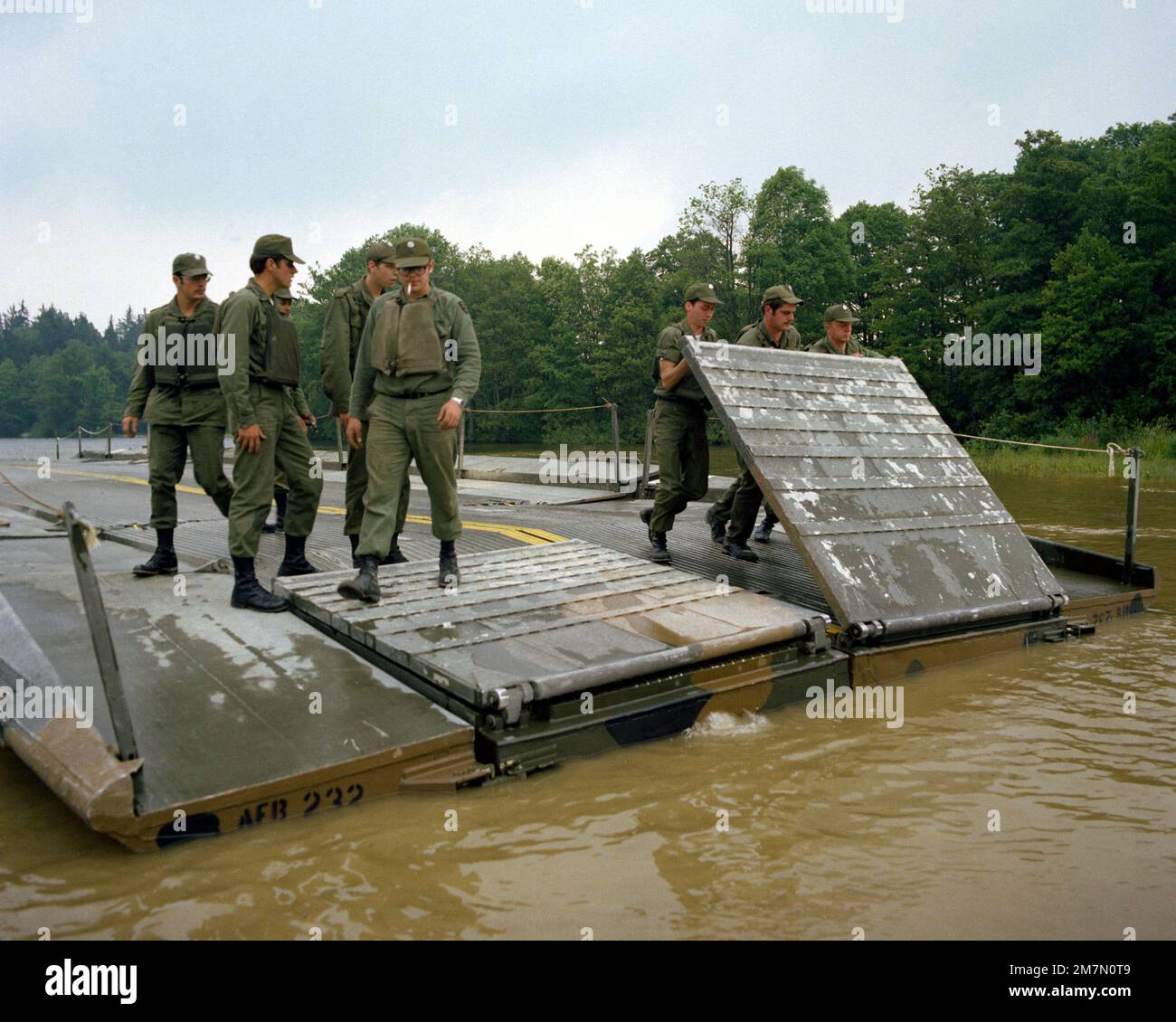 A ribbon bridge is assembled by members of the 1457th Engineering ...