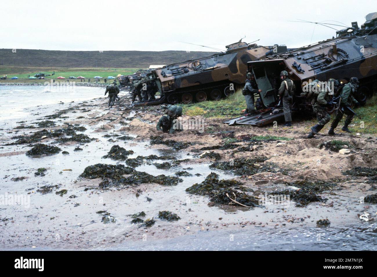 Combat-ready Marines of the 4th Marine Amphibious Brigade charge out of ...