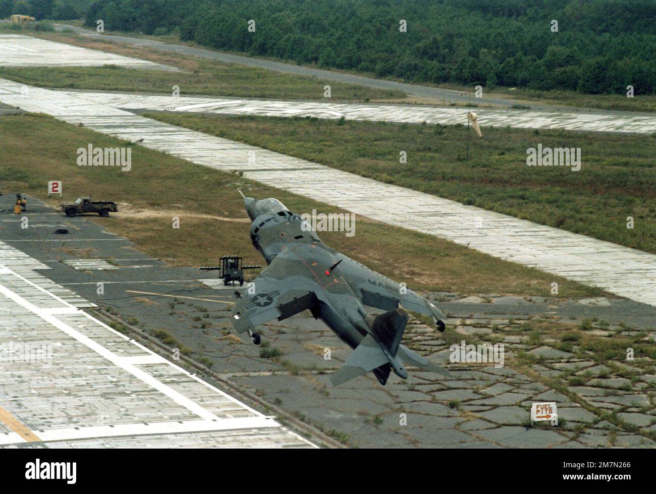 An air-to-air right rear view of a Marine AV-8A Harrier aircraft taking ...