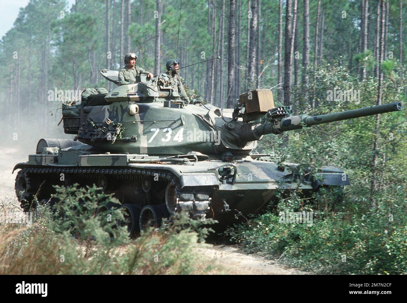Members of the 24th Infantry Division maneuver an M60A1 main battle ...