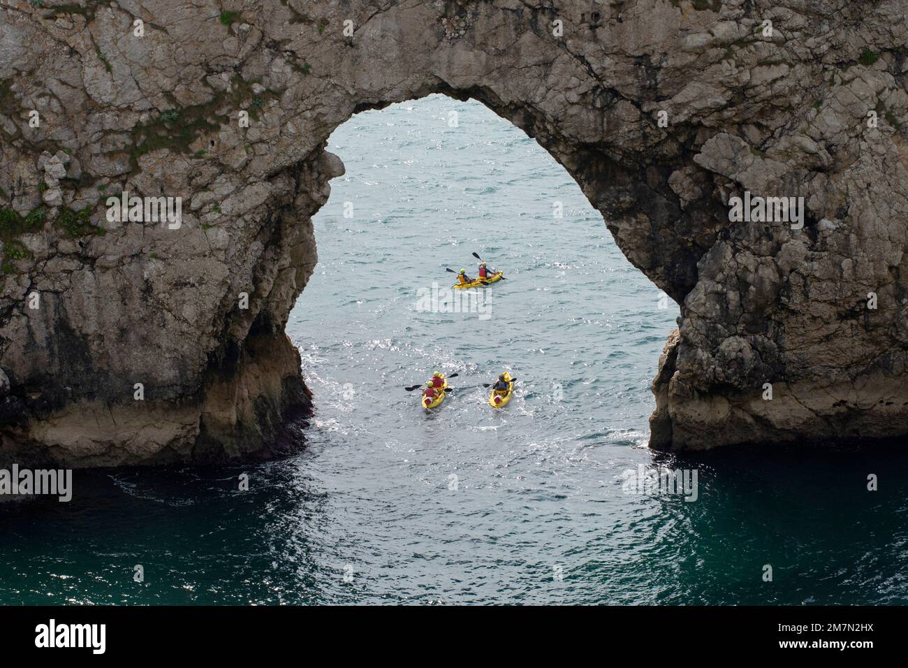 Four Kayakers paddling in Durdle Door Stock Photo - Alamy