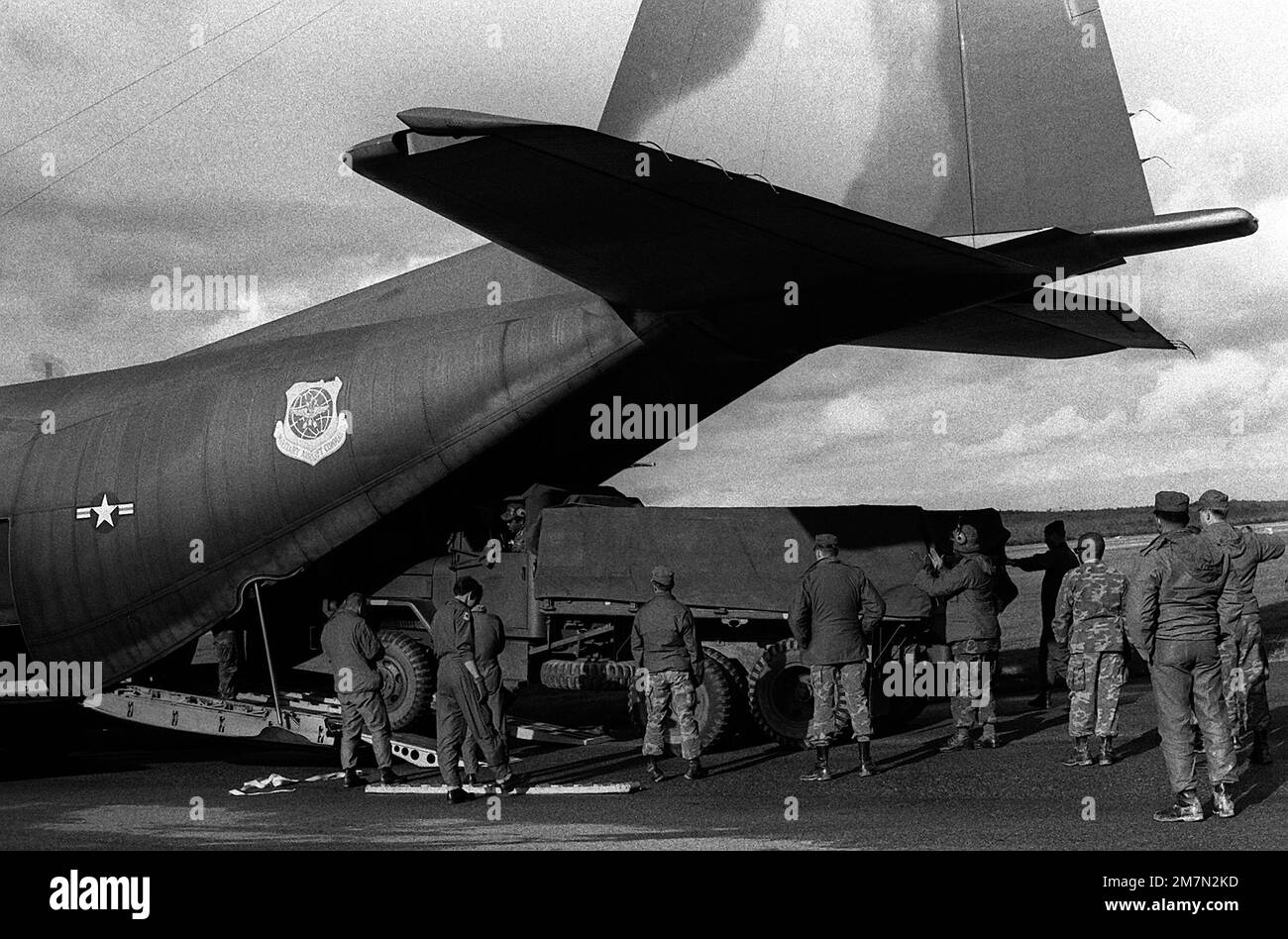 Marines from Marine Air Base Squadron 12, 1ST Marine Air Wing, unload a ...