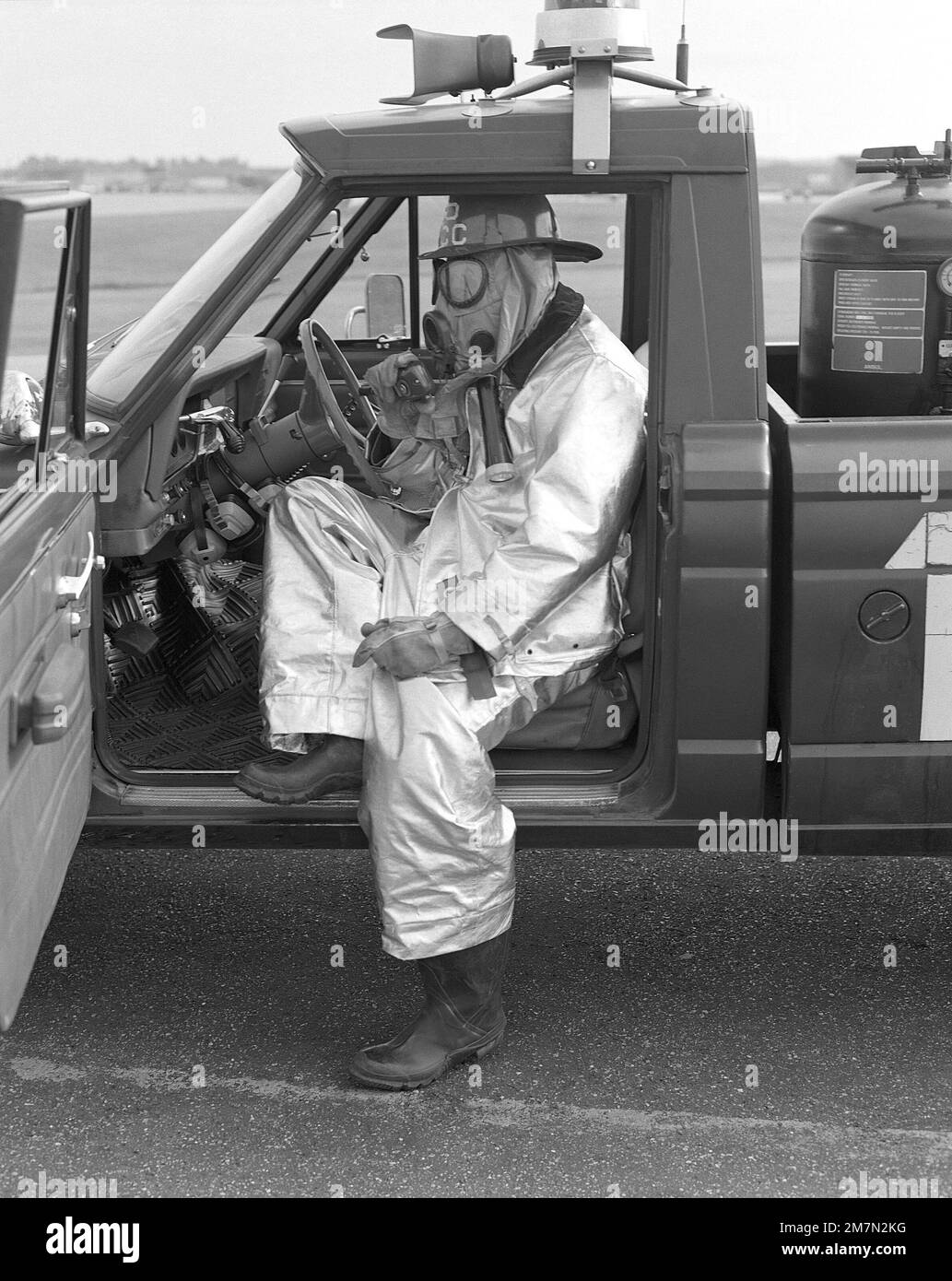 Technical Segeant Wayne E. Hardy, assistant fire chief, wears ...