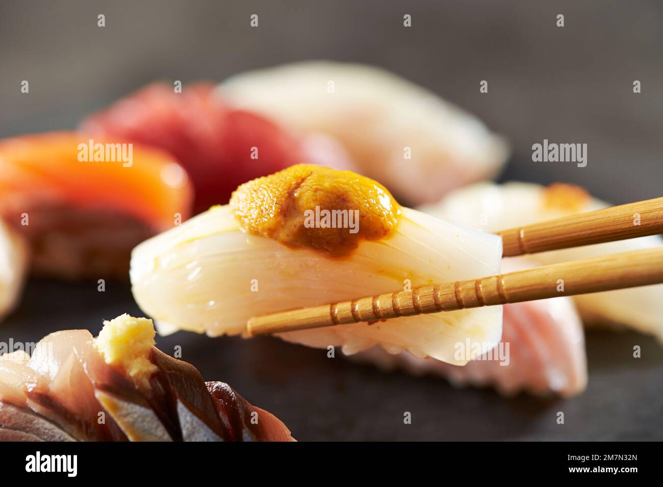 Sea urchin sushi on squid sashimi Stock Photo - Alamy