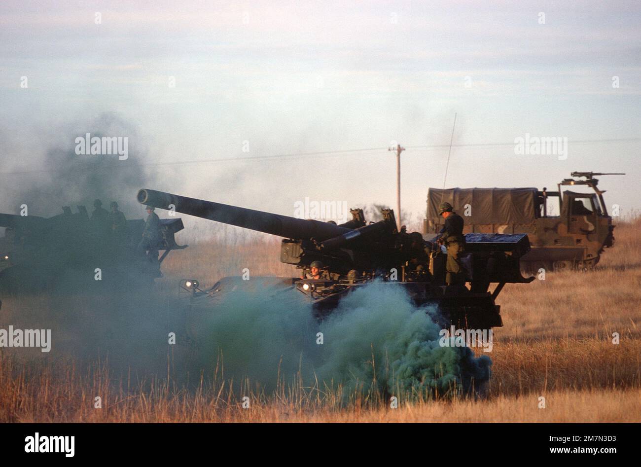 An M110 203 mm self-propelled howitzer is hidden by smoke during a ...