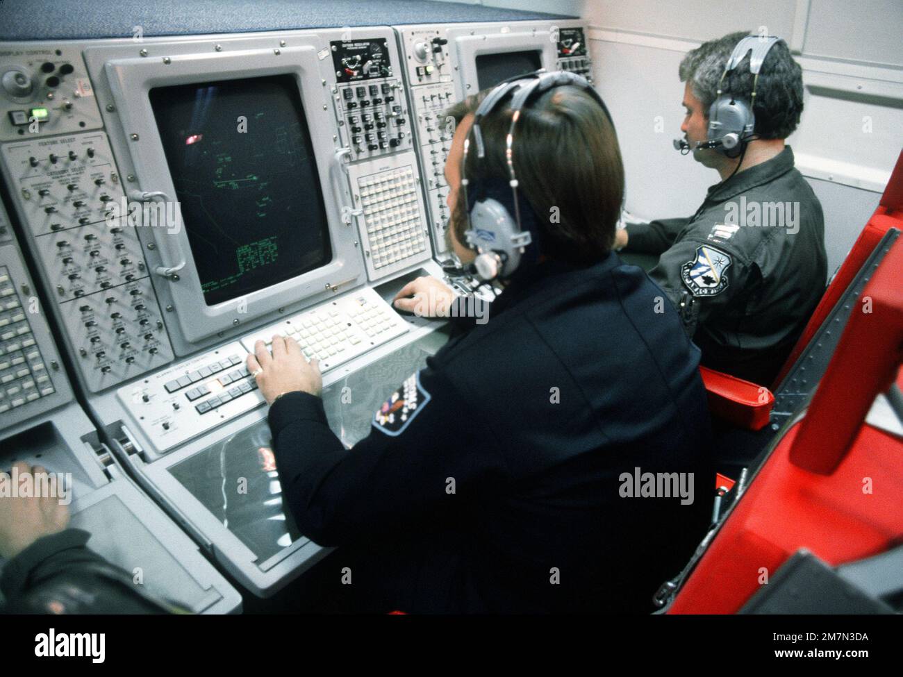An Air Force air surveillance officer and a U.S. Customs air officer ...