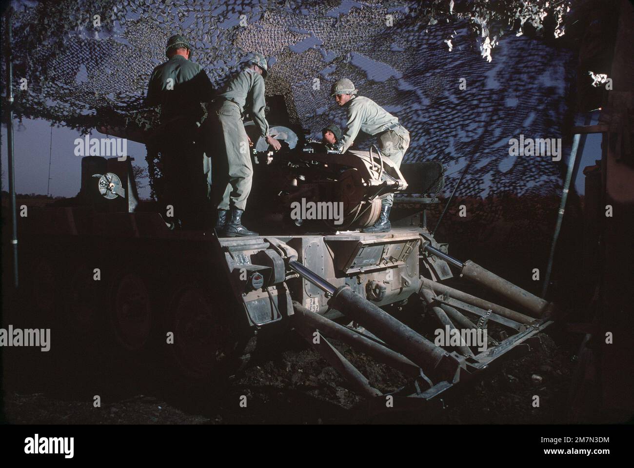 The crew of an M110 203 mm self-propelled howitzer participates in a ...