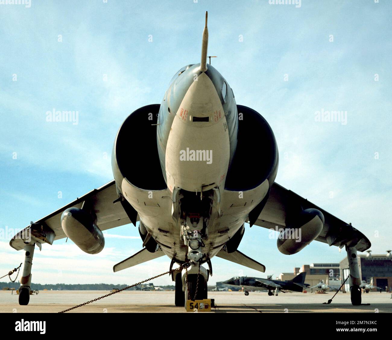 A front view of a Marine TAV-8A Harrier aircraft sitting on the flight ...