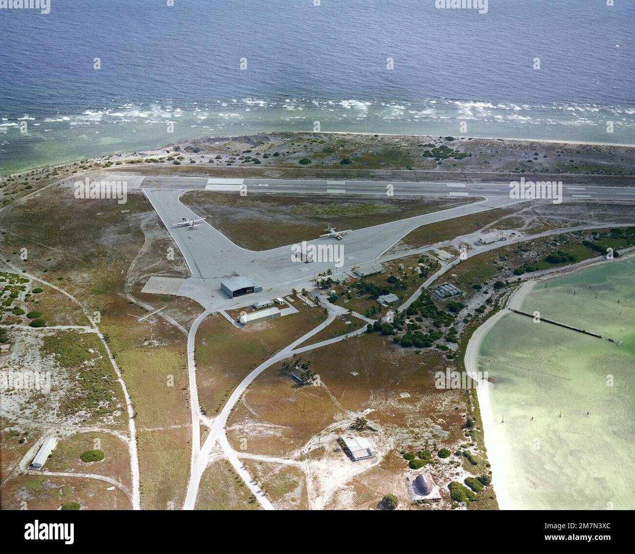 An aerial view of the runway and flight line facilities on Phoenix ...