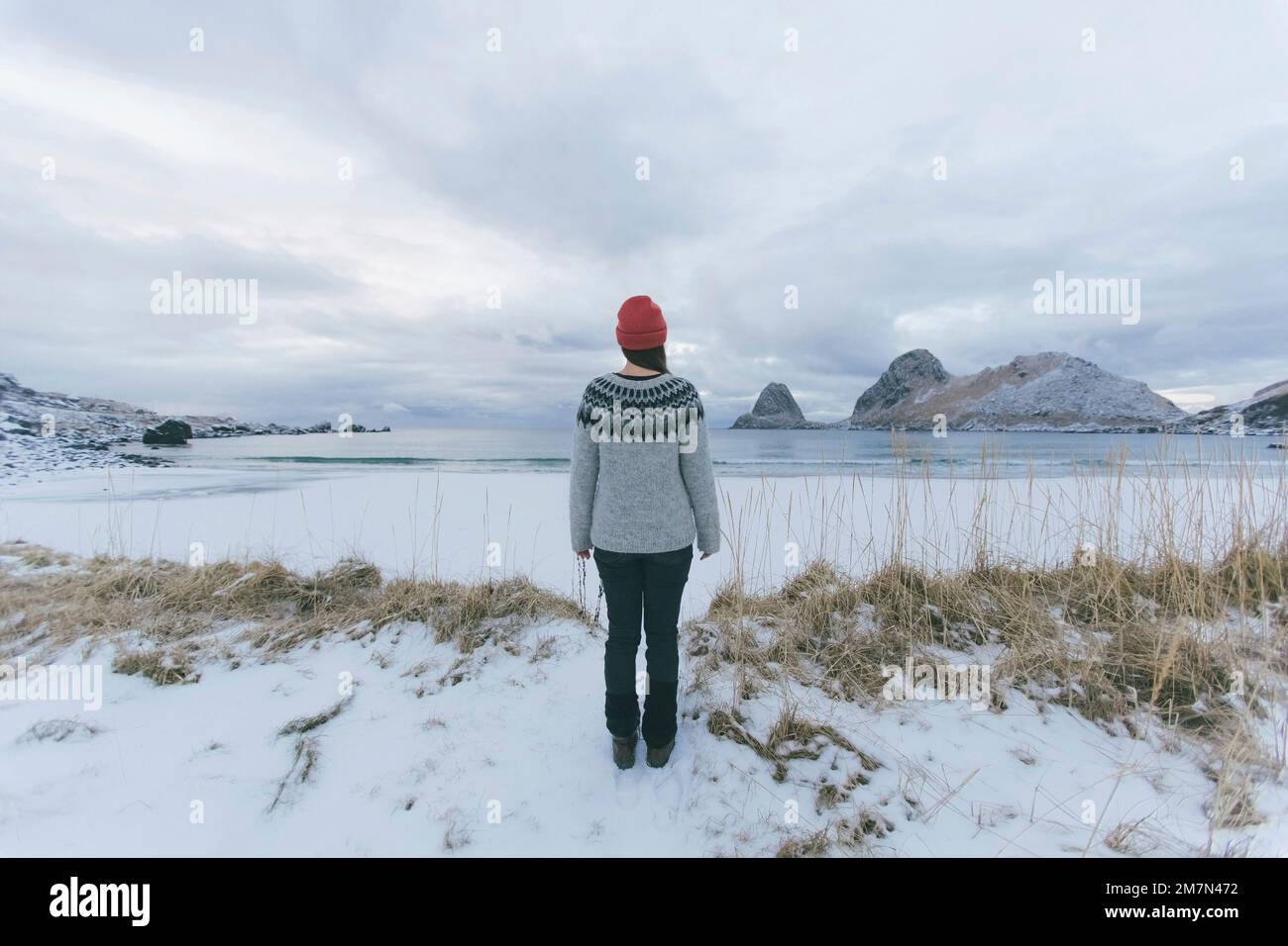 Young woman with red cap on beach Stock Photo - Alamy