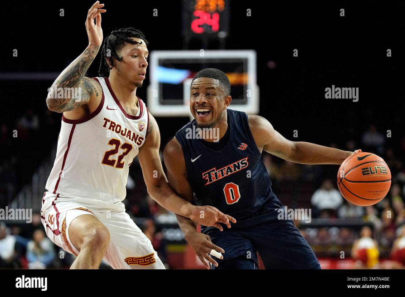 Cal State Fullerton guard Jalen Harris, right, drives by Southern ...