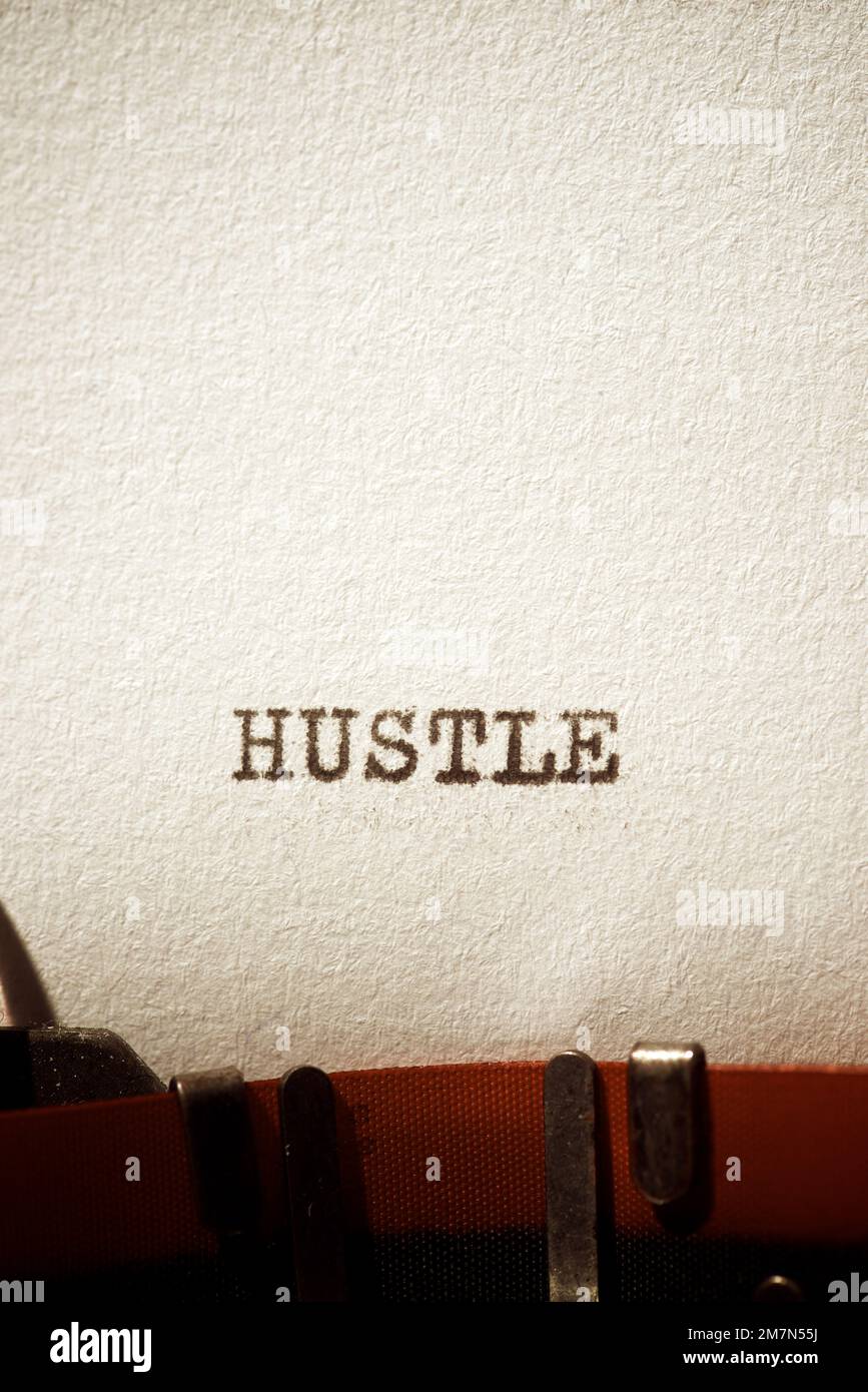 Hustle word written with a typewriter Stock Photo - Alamy