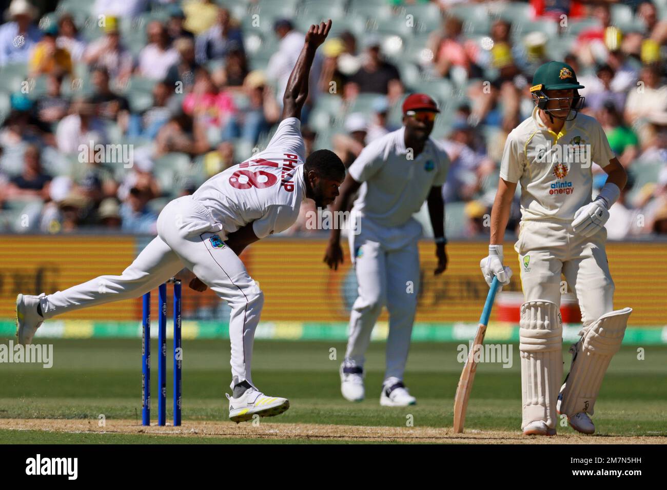 West Indies' Anderson Phillip, left, bowls as Australia's Marnus ...