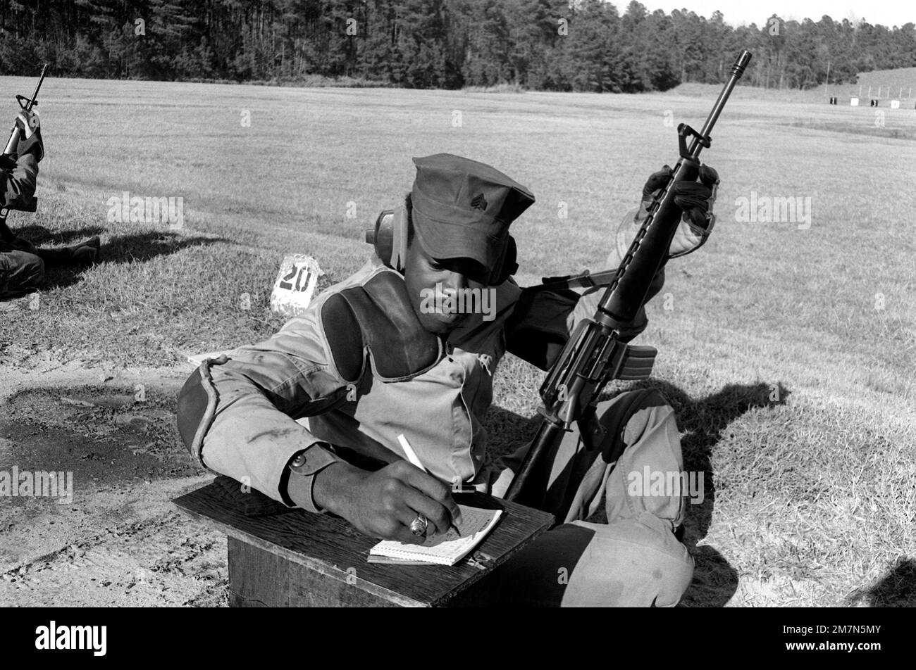 SGT Frederick O'Neal checks his data book prior to going to the firing ...