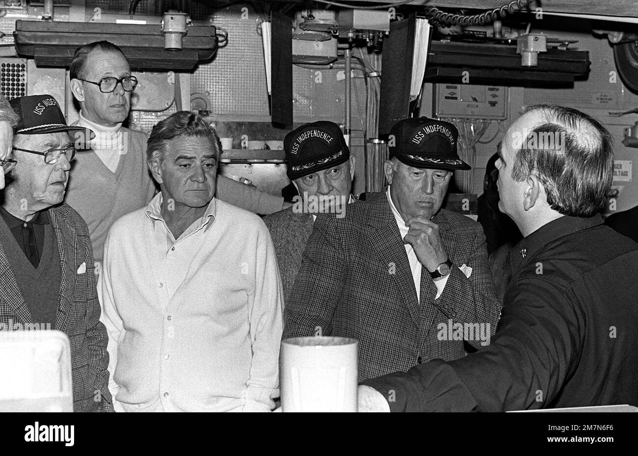 Undersecretary of the Navy Robert Baldwin, left rear, and members of ...