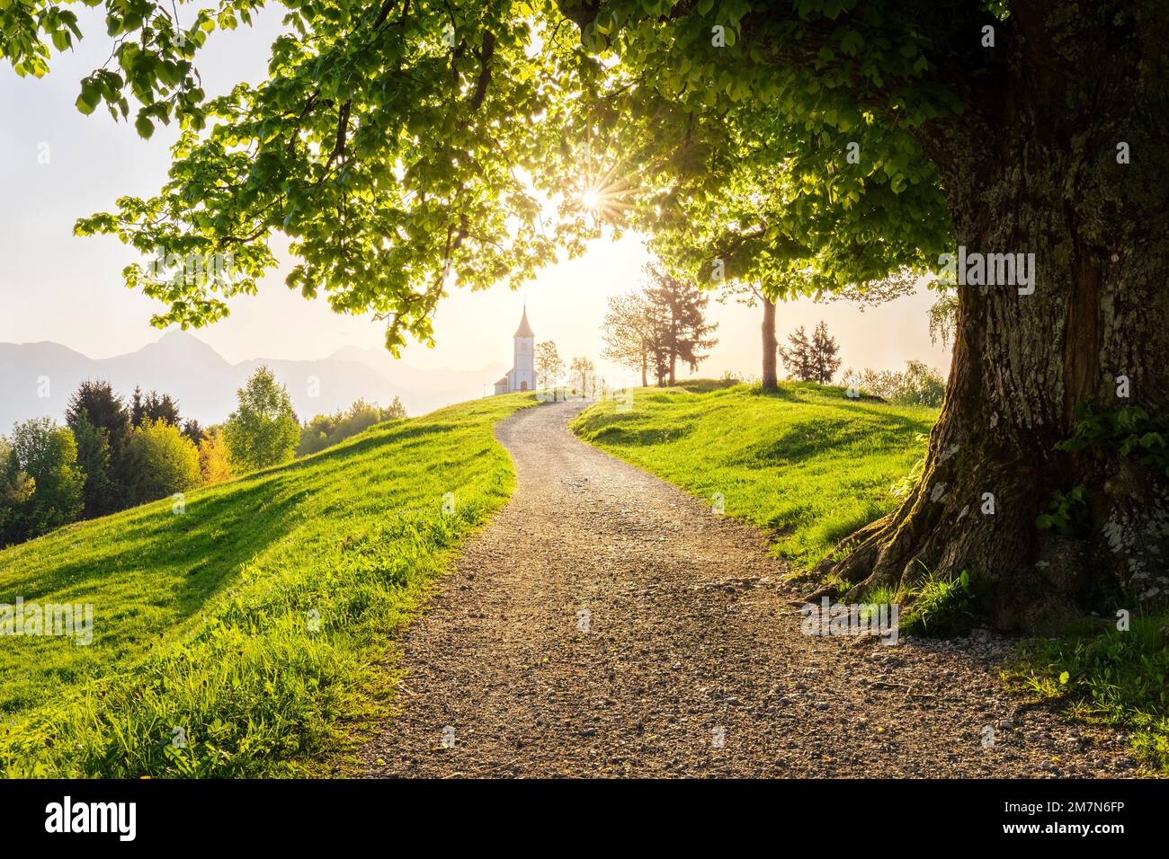 View of the iconic Jamnik church, with Mount Triglav on the background ...