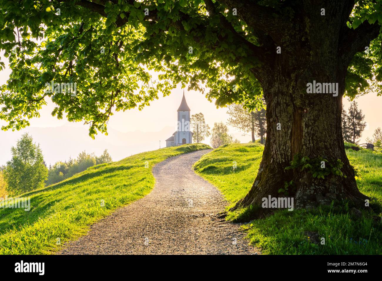 View of the iconic Jamnik church, with Mount Triglav on the background ...