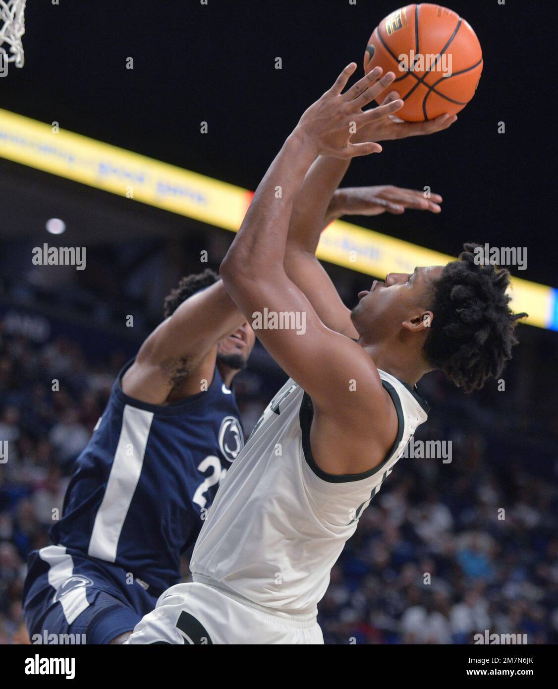 Michigan State's A.J. Hoggard, right, shoots over Penn State's Jalen ...