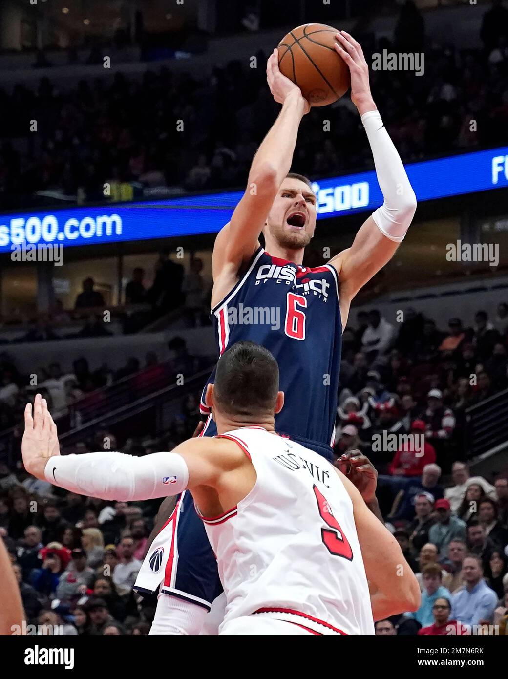 Washington Wizards' Kristaps Porzingis shoots over Chicago Bulls' Nikola Vucevic during the ...