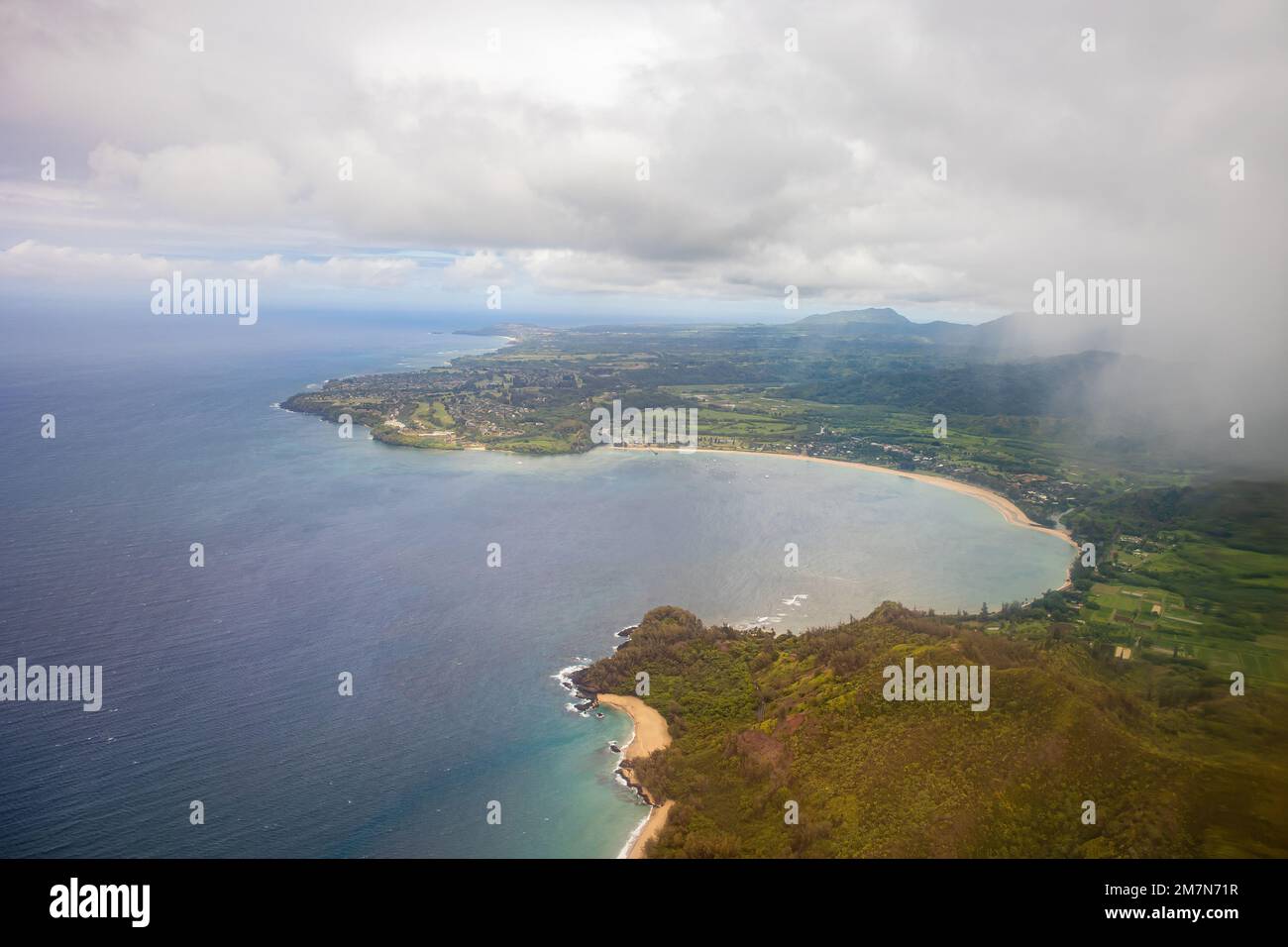 A drone shot of green coast on a sea under the cloudy sky, cool for ...
