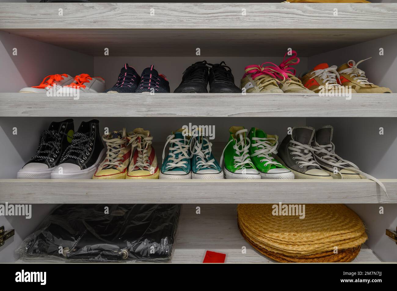 Wardrobe with different shoes at shelves Stock Photo - Alamy