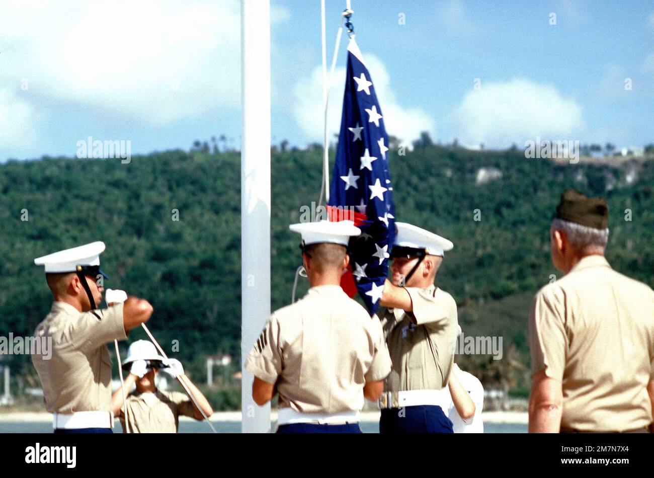General Louis H. Wilson, Commandant of the Marine Corps, watches as ...