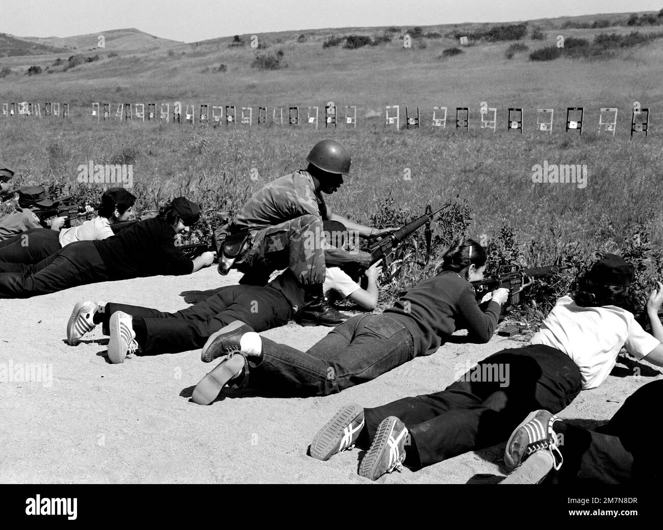 Female Marine Corps JROTC students practice firing the M-16A1 rifle at ...