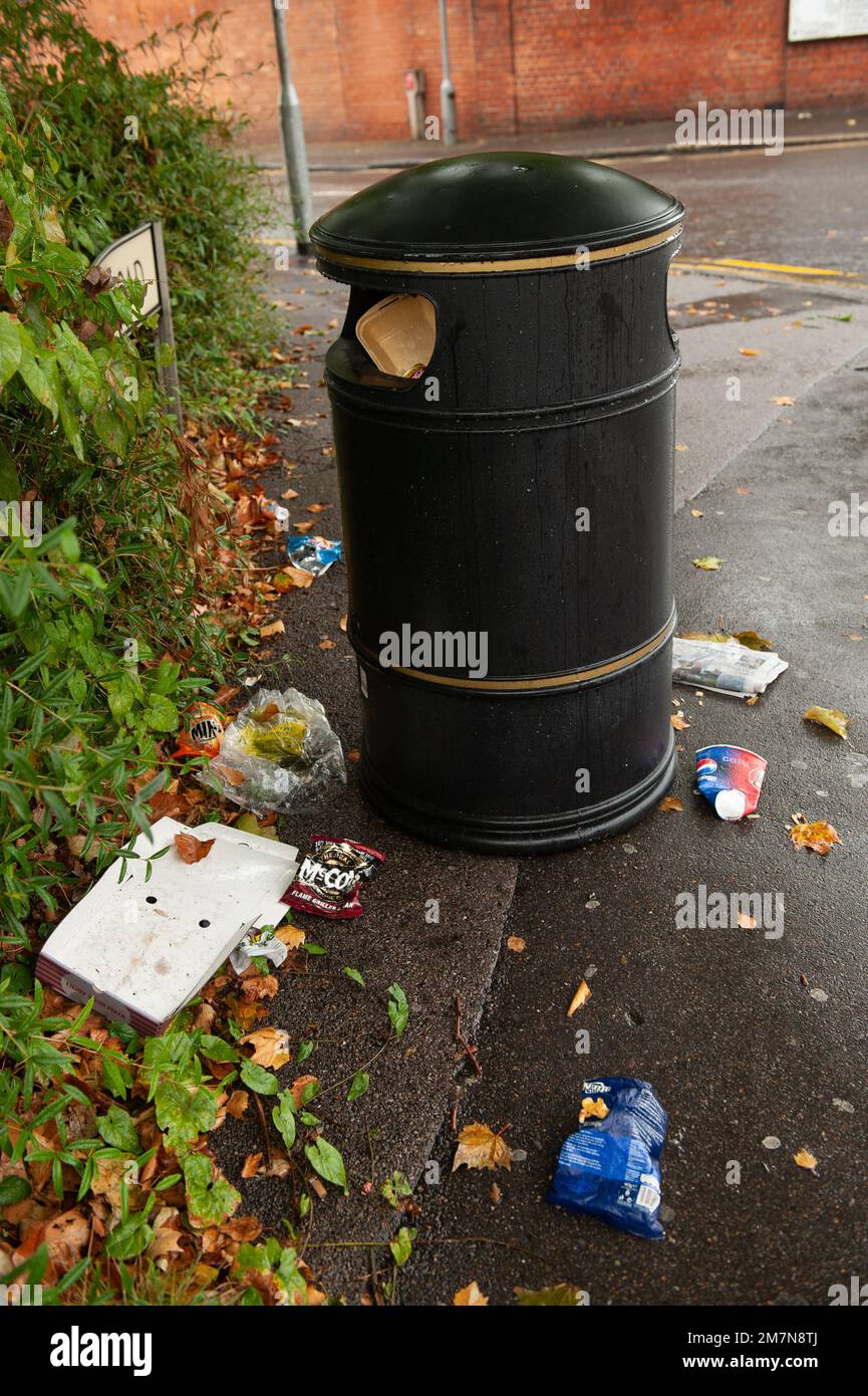 Overfilled black rubbish bin in Reading near Orts Road, off the Kings ...