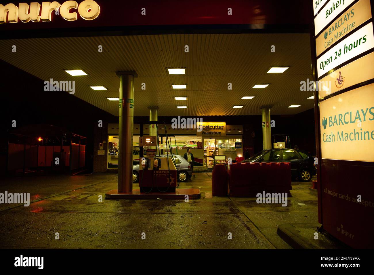 Murco Petrol station with Cost Cutter at night in Reading, Berkshire ...