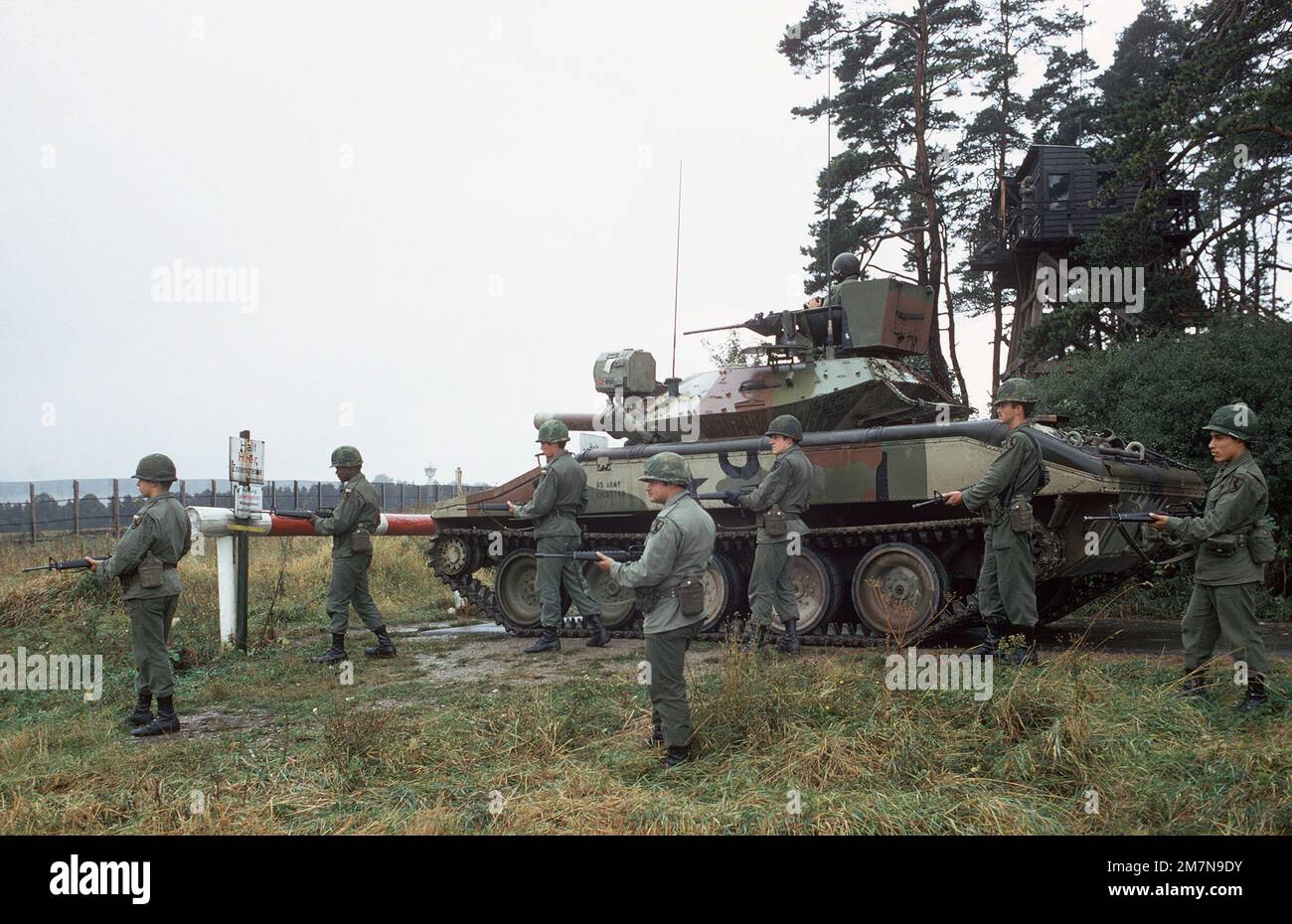 Members of the 11th Armored Cavalry deploy around an M551 Sheridan ...