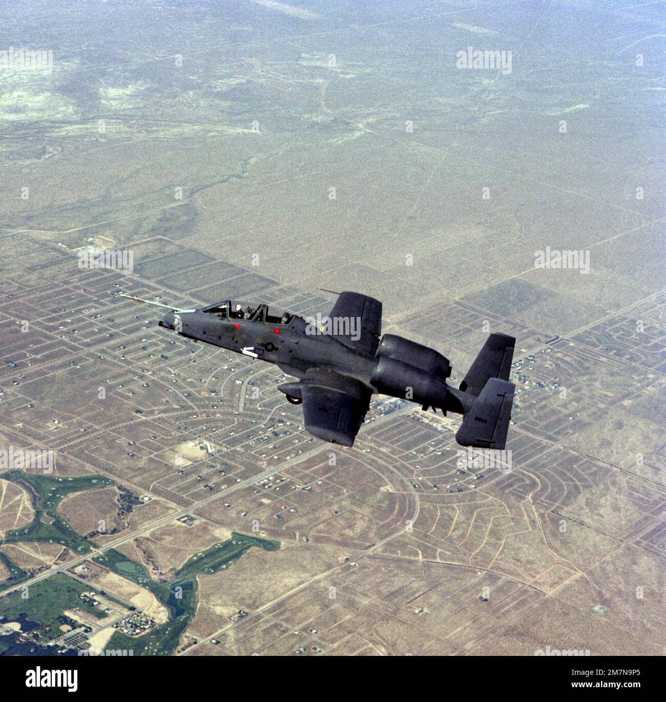 Air-to-air left side view of an A-10 Thunderbolt II aircraft during a ...