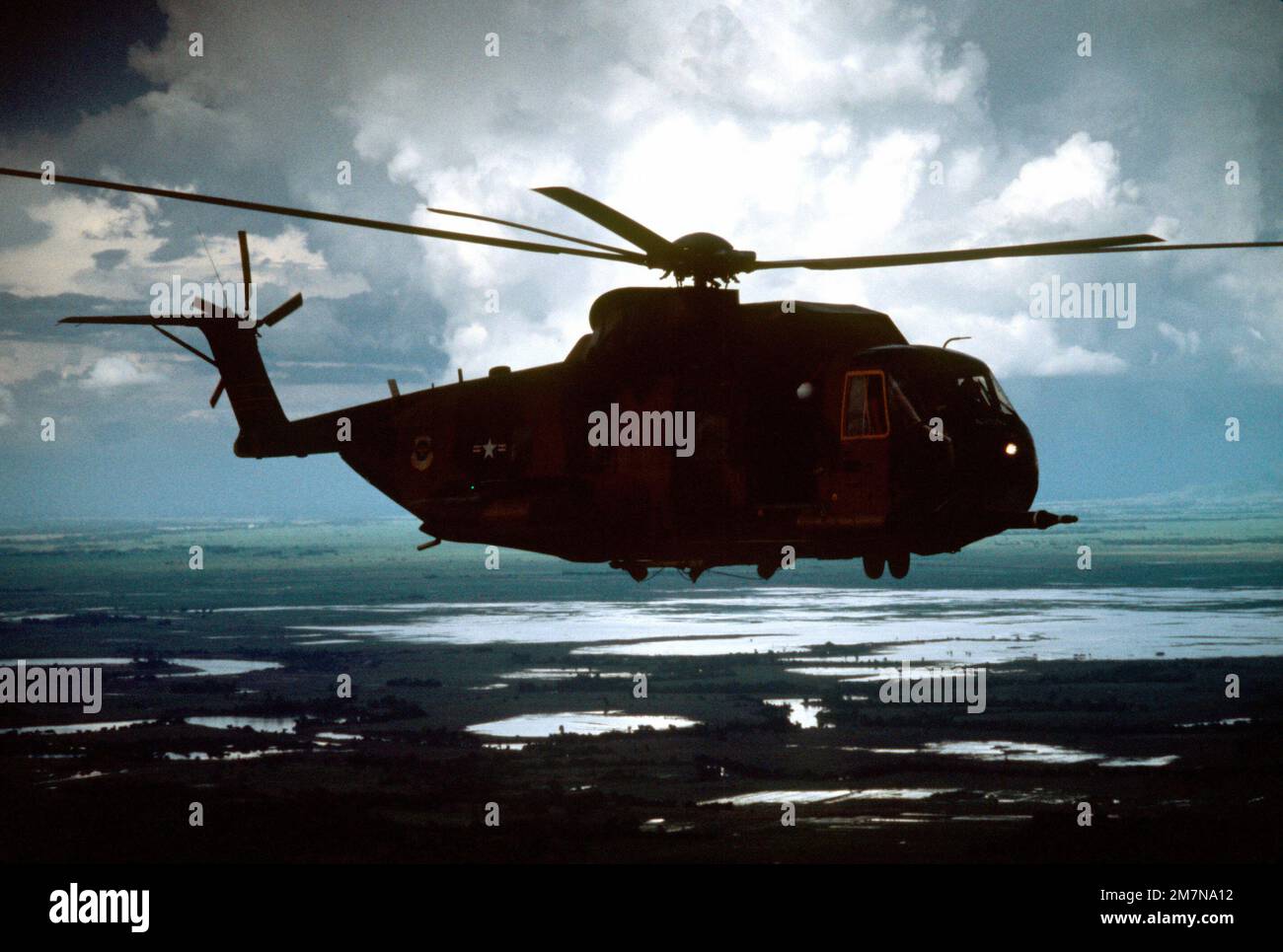 Early morning low level flight of a CH-3 Jolly Green Giant helicopter ...