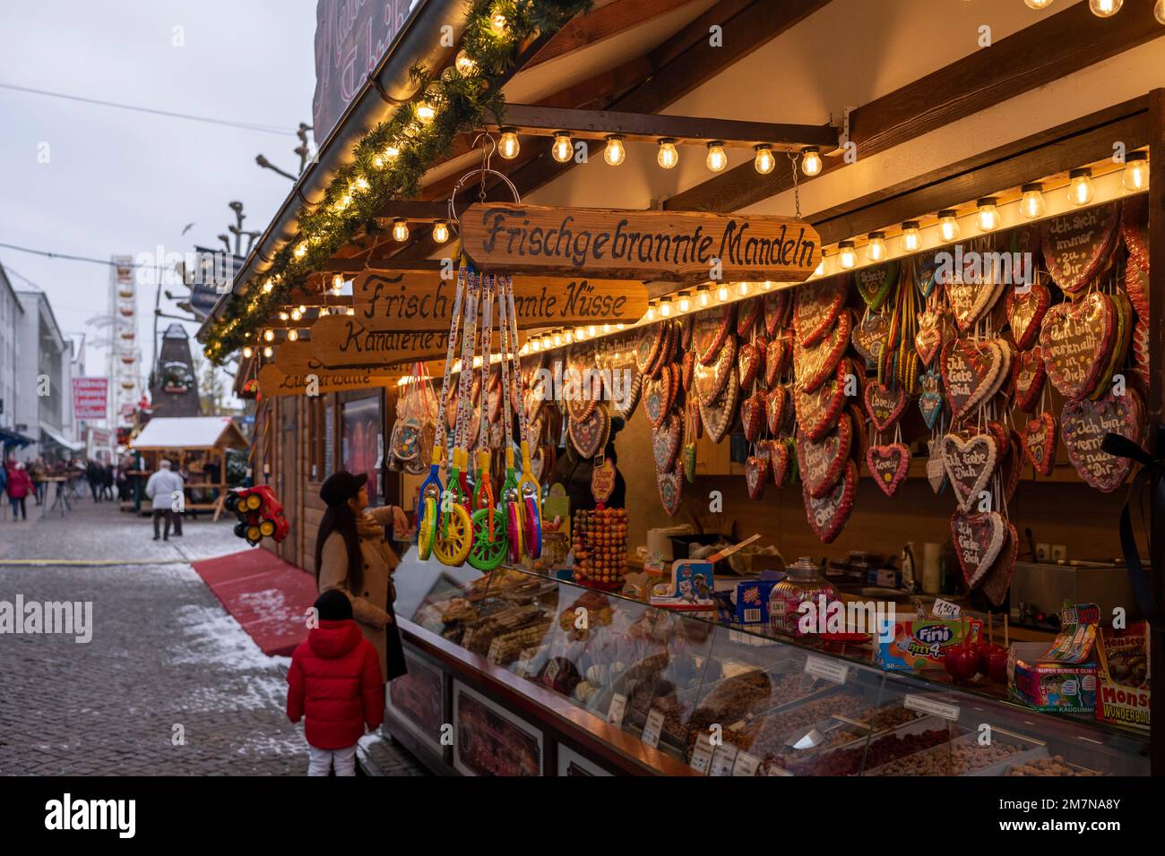 Stalls at a Christmas market with Christmas food and sweets on the day ...