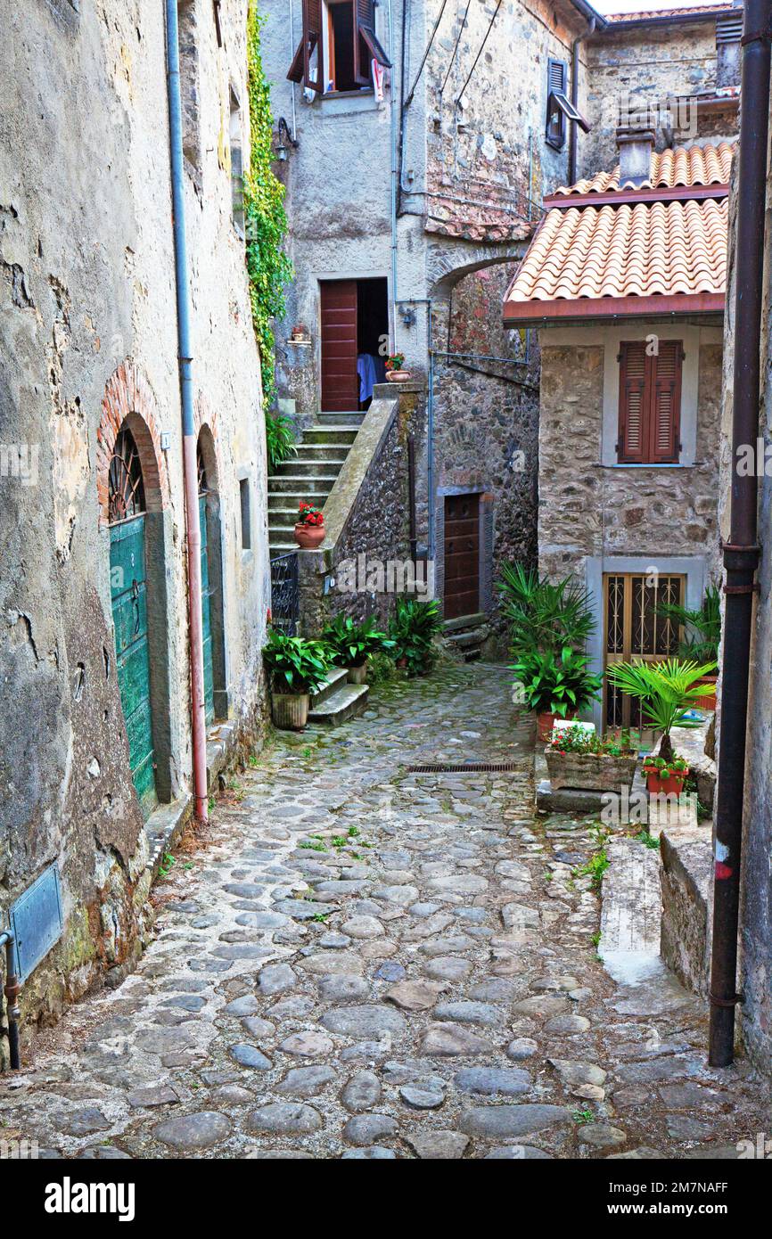 steep alley between stone houses in Bagnone, Western Tuscany Stock ...