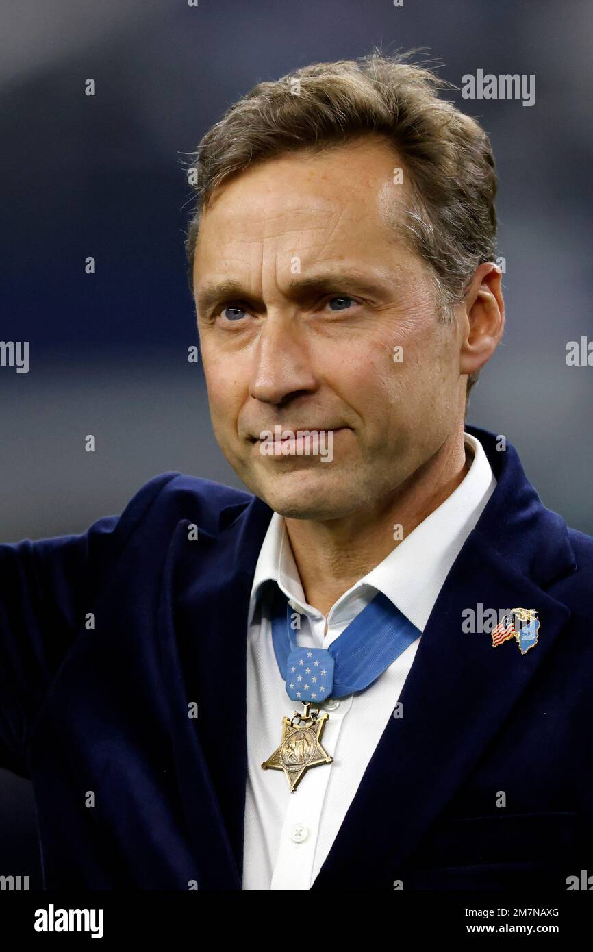 Medal of Honor recipient Britt Slabinski is honored during an NFL ...