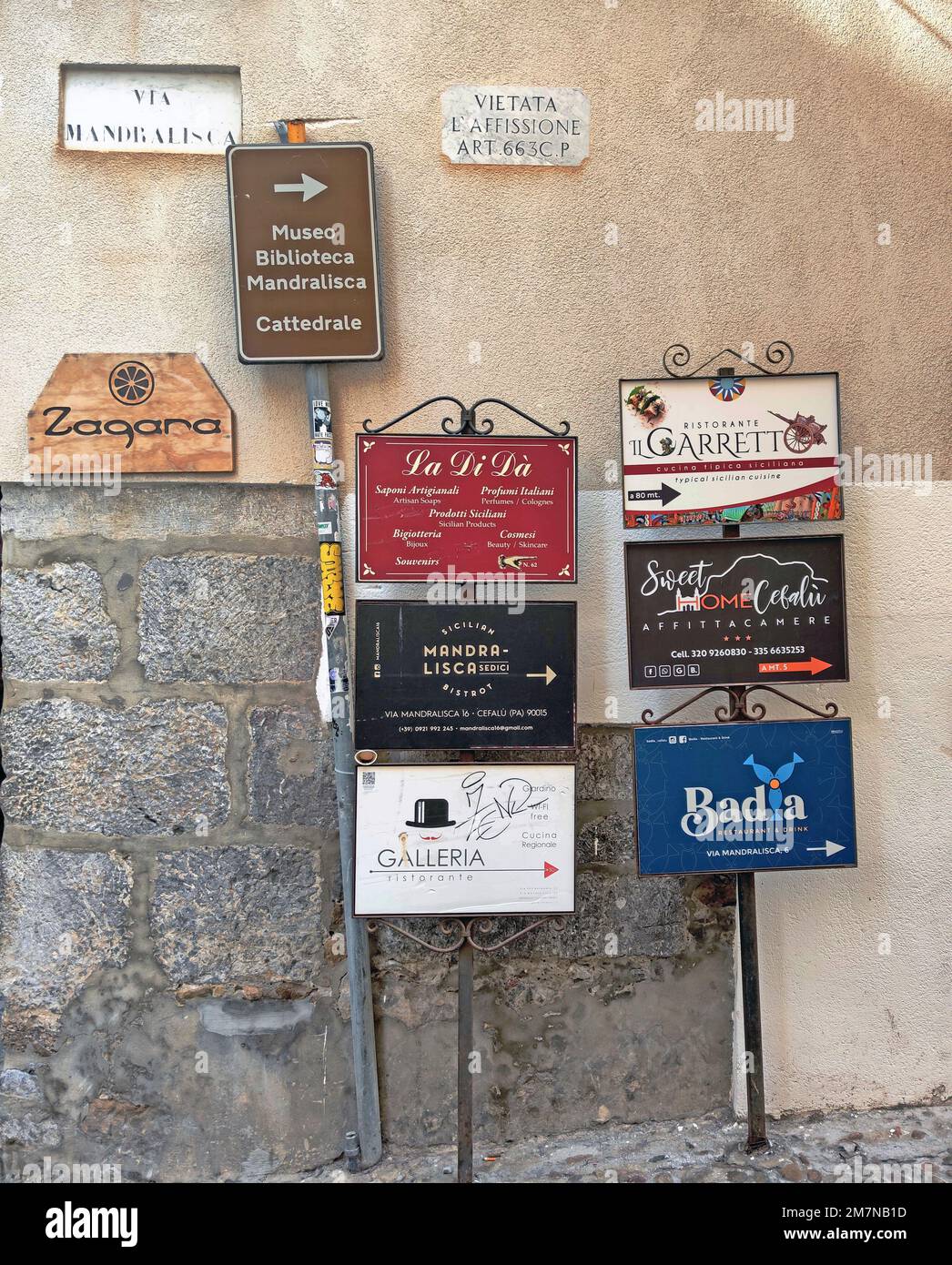Signs and information in wrought iron frames in cefalu hi-res stock ...