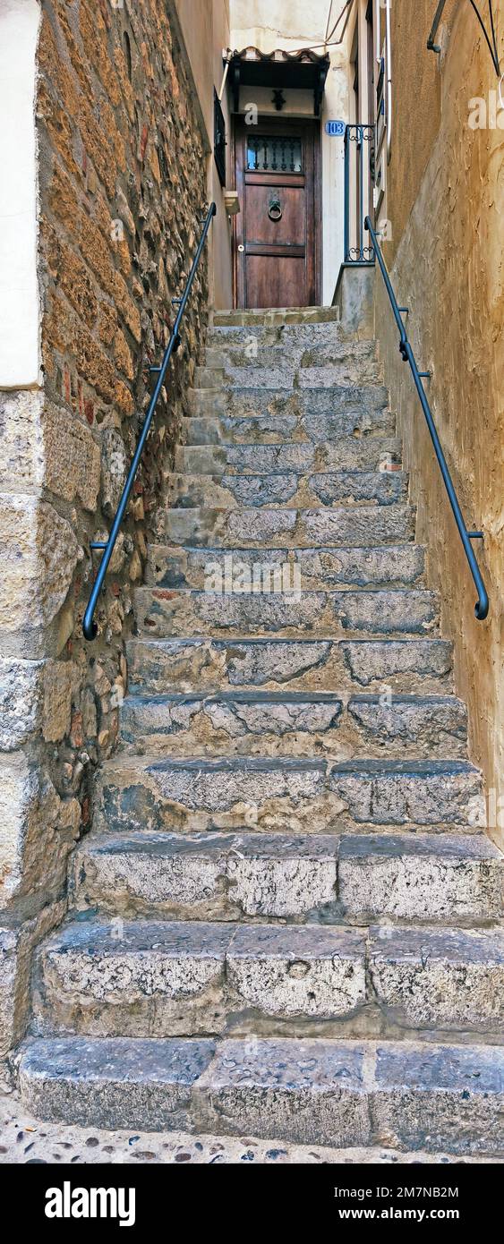 steep long stone stairs leading up to the front door, Cefalu, Sicily ...