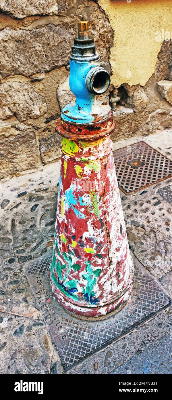 Hydrant, colorfully painted in the town of Cefalu, Sicily Stock Photo ...
