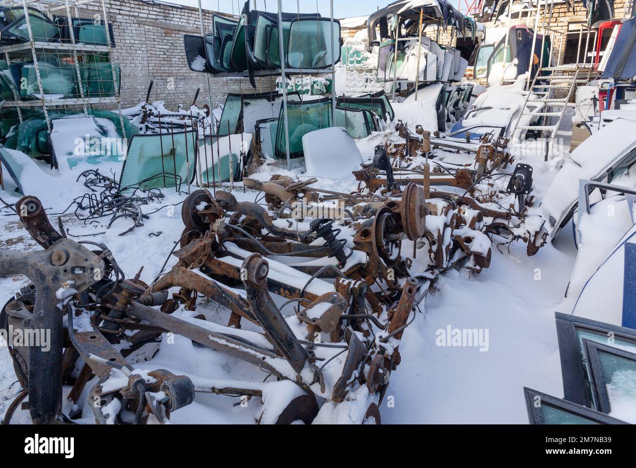 Disassembled cars on a car dump are on sale for spare parts. A stack of ...