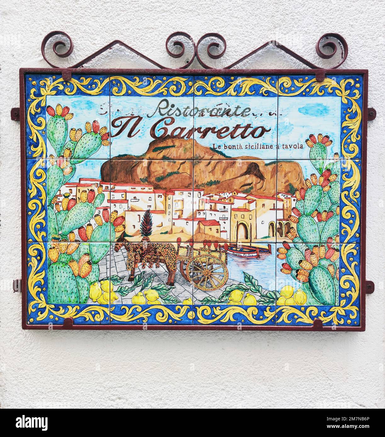 Colorful wall tiles advertising board for restaurant in Cefalu, Sicily ...